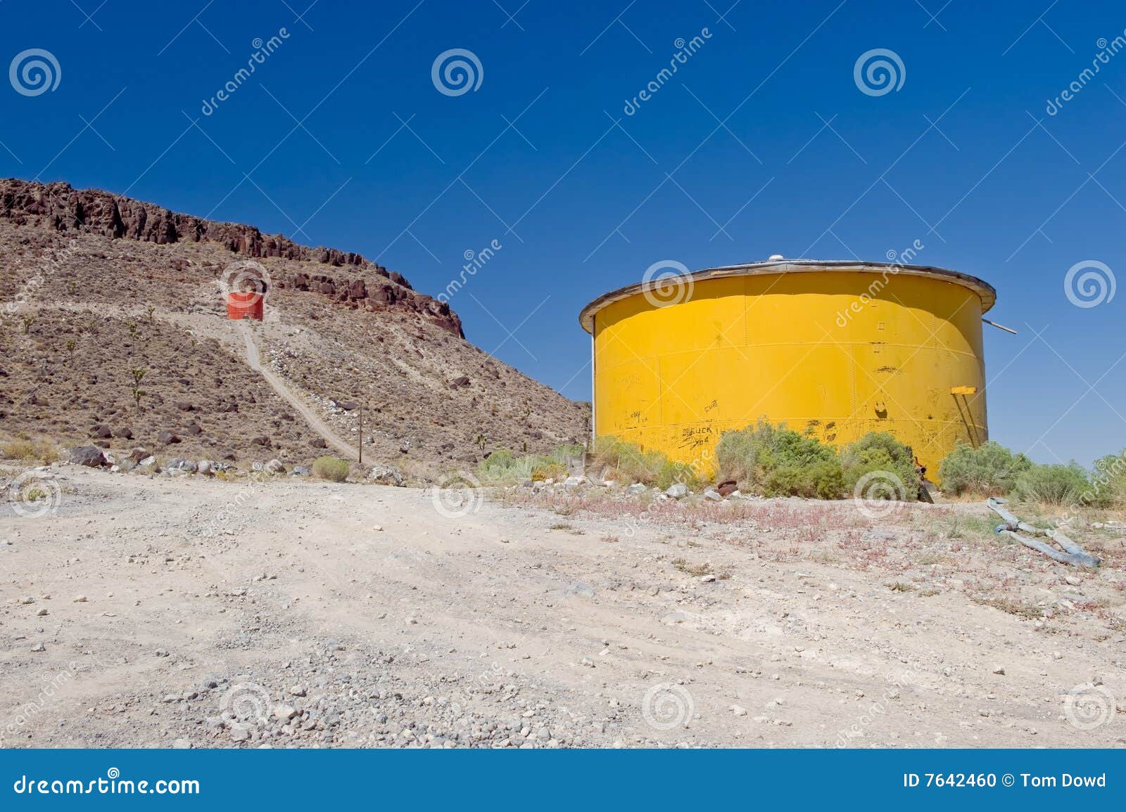 Yellow Water Tank in Desert Stock Photo - Image of single, container ...