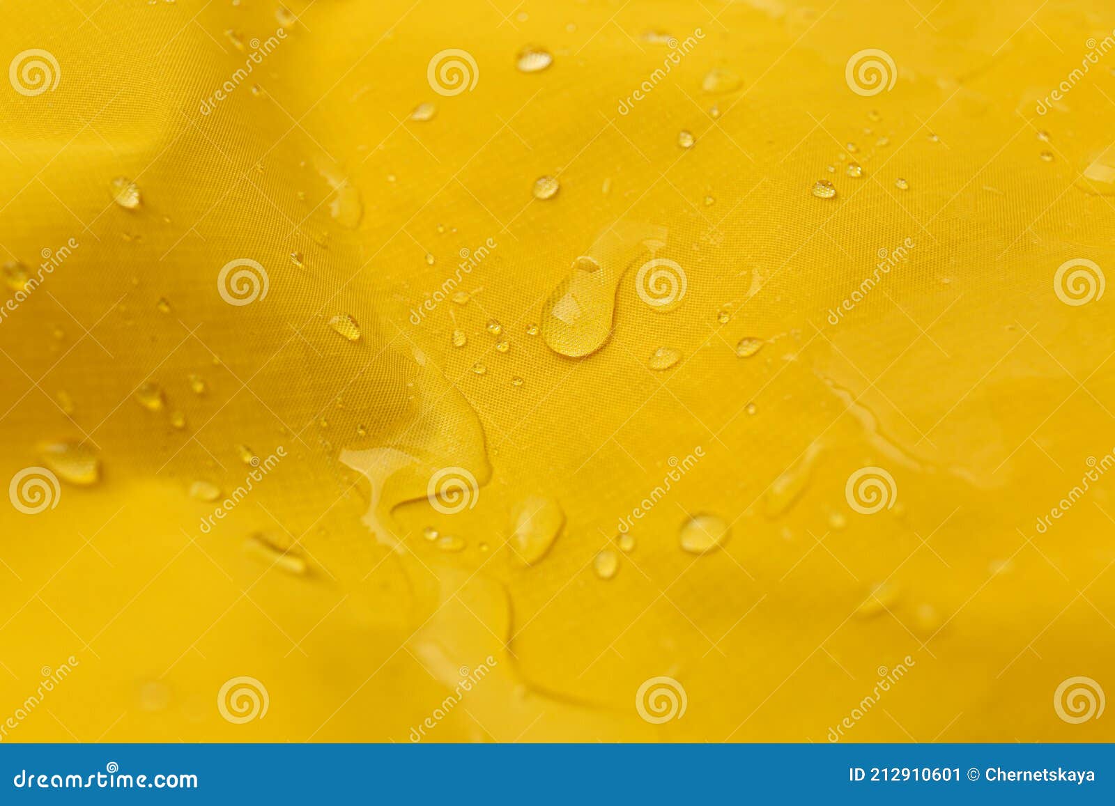 Yellow Waterproof Fabric with Water Drops As Background, Closeup Stock ...