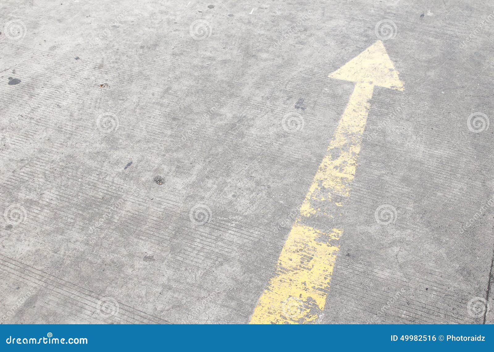 Yellow Way Arrow Pointing Symbol on a Ground Road Surface Stock Photo ...