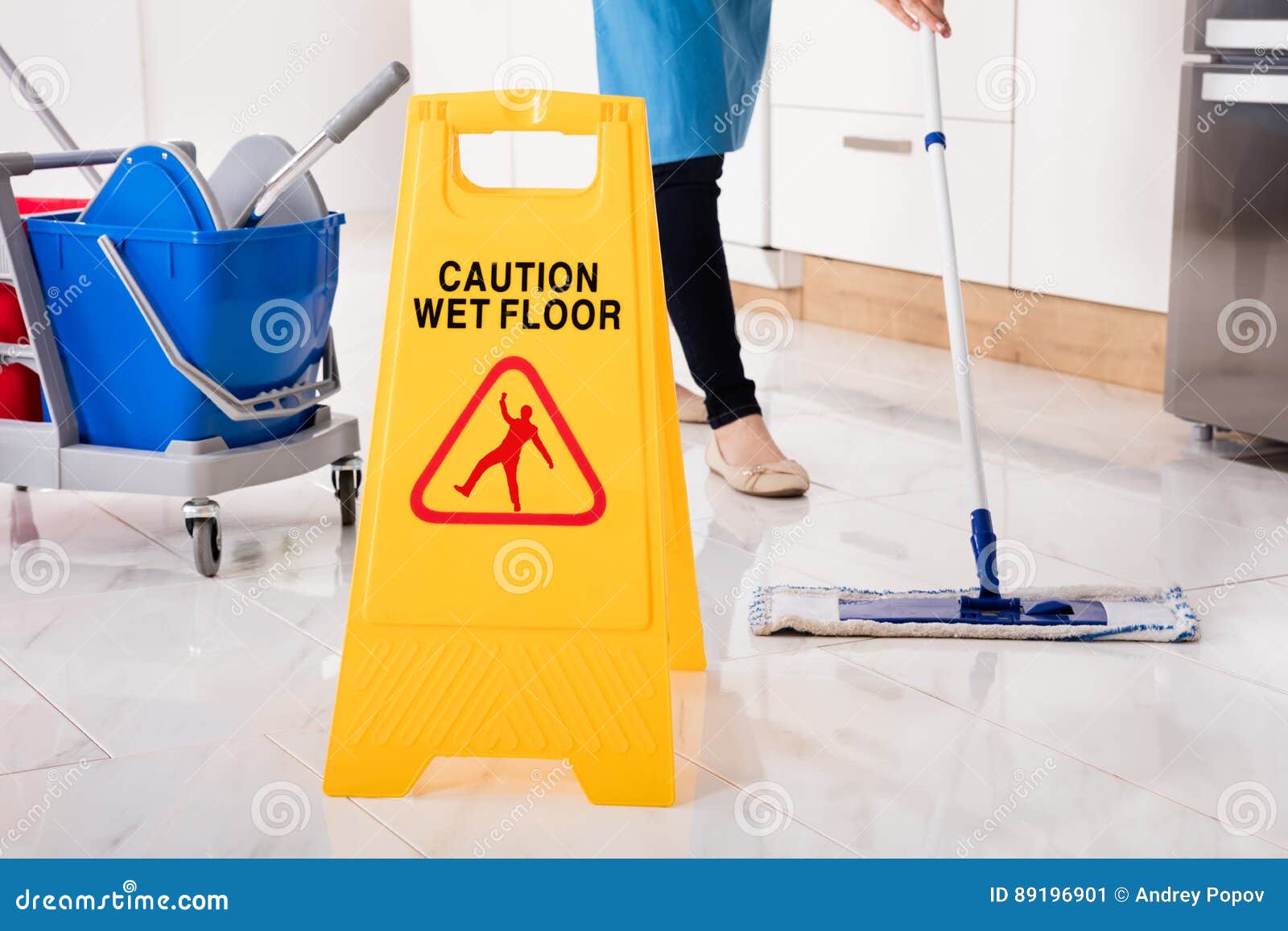 Yellow Wet Caution Sign on Wet Floor in Kitchen Stock Image - Image of ...