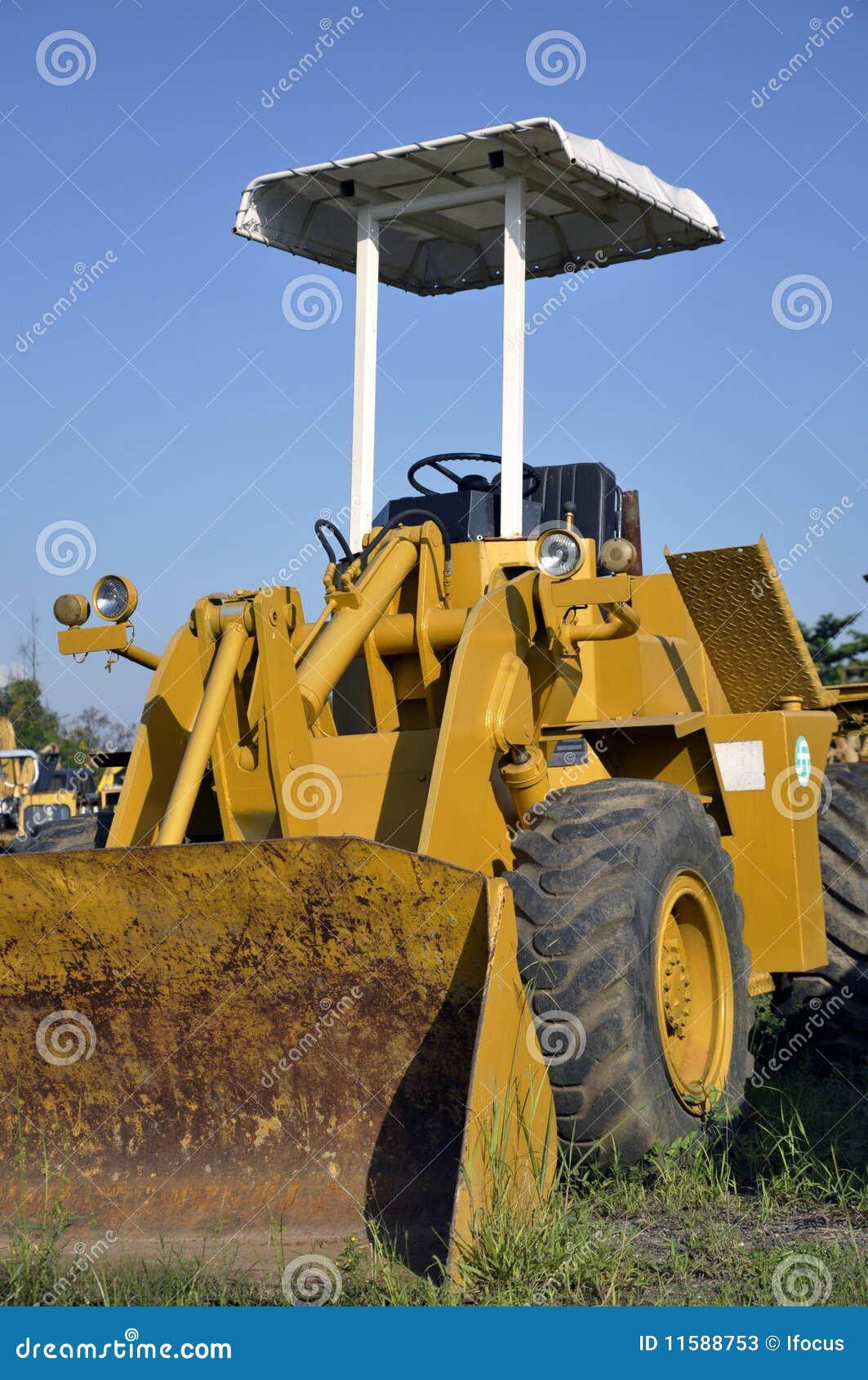 Yellow wheel Dozer stock image. Image of construction - 11588753