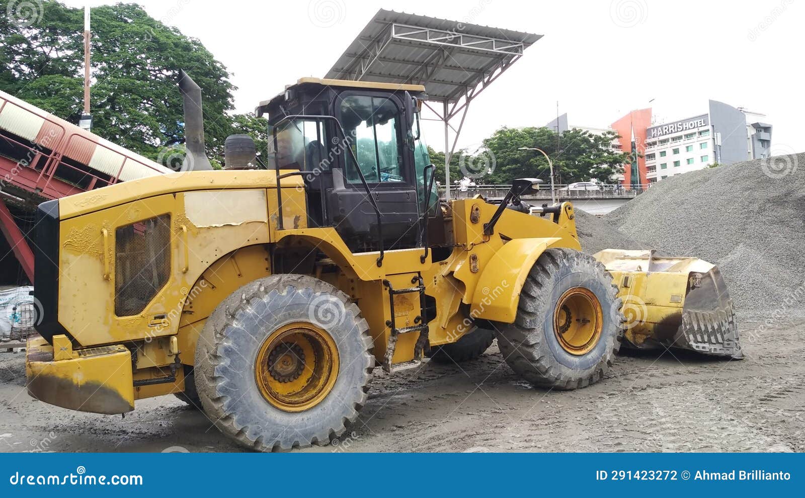 Yellow Wheel Loader on a Building Construction Site during the Day ...