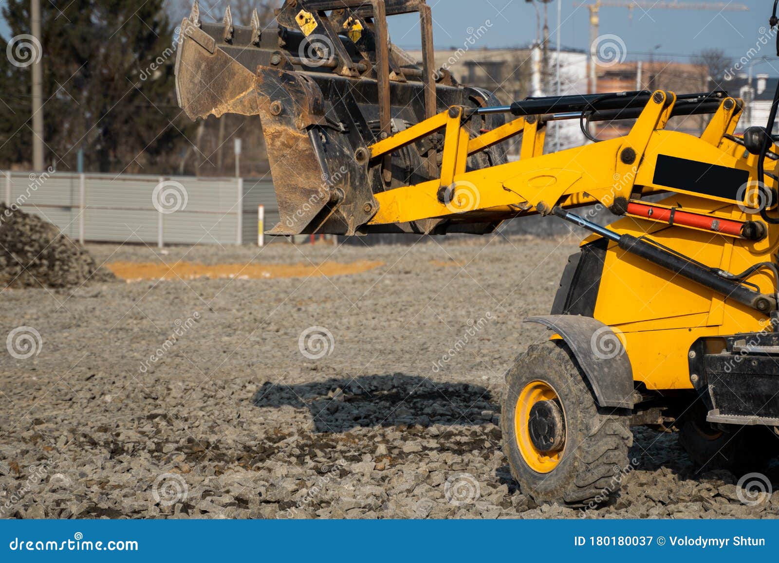 Yellow Wheel Loader Excavator Machine Working at Construction Site with ...