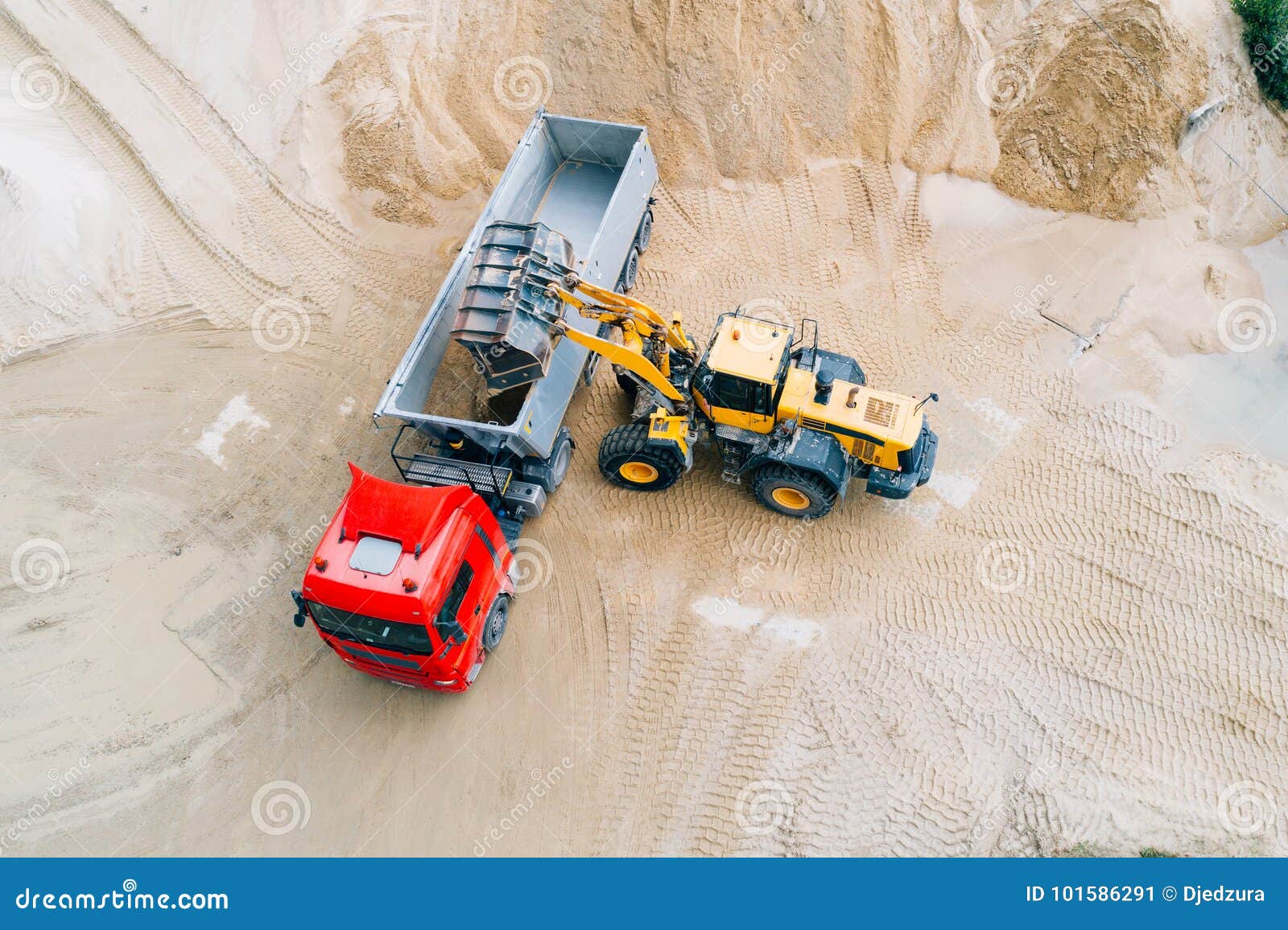 Yellow Wheel Loader Loading Sand on Dumper Truck Stock Image - Image of ... Yellow Wheel Loader Loading Sand on Dumper Truck Stock Image - Image of ...