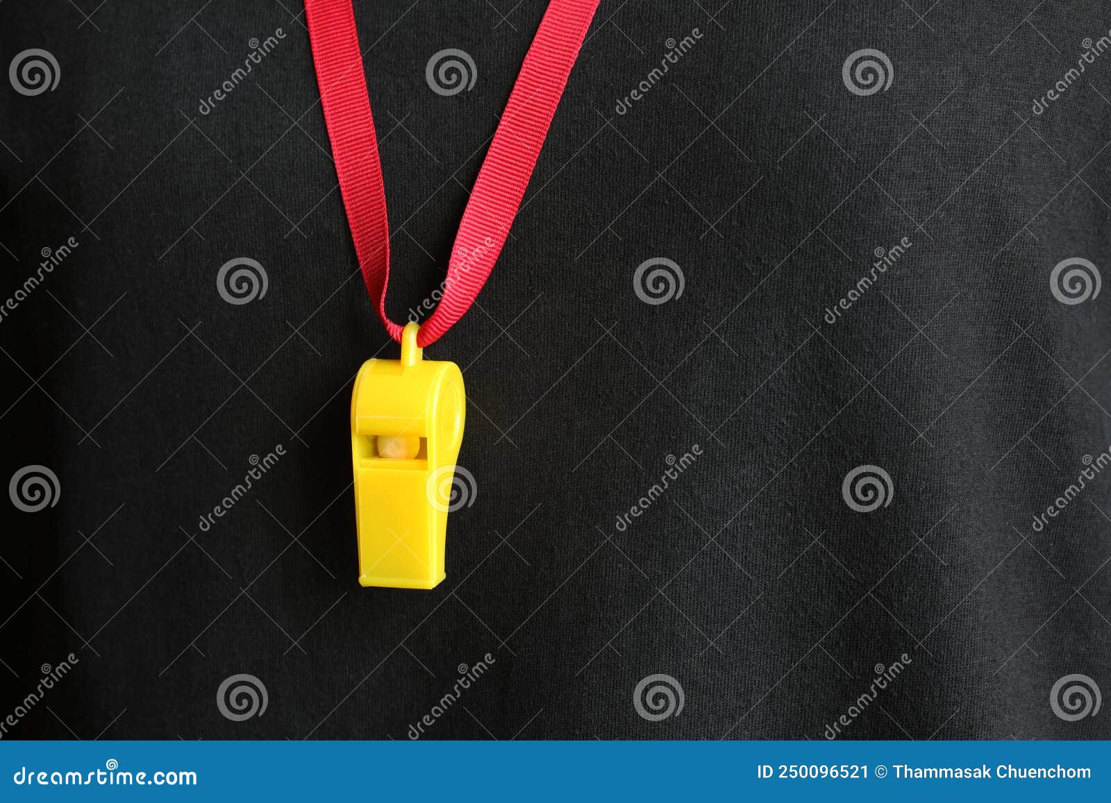 A Yellow Whistle with a Red String Hanging with the Referee`s Shirt ...