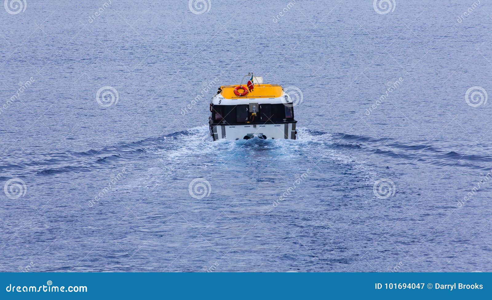 Yellow and White Lifeboat Cutting through Blue Water Stock Image ...
