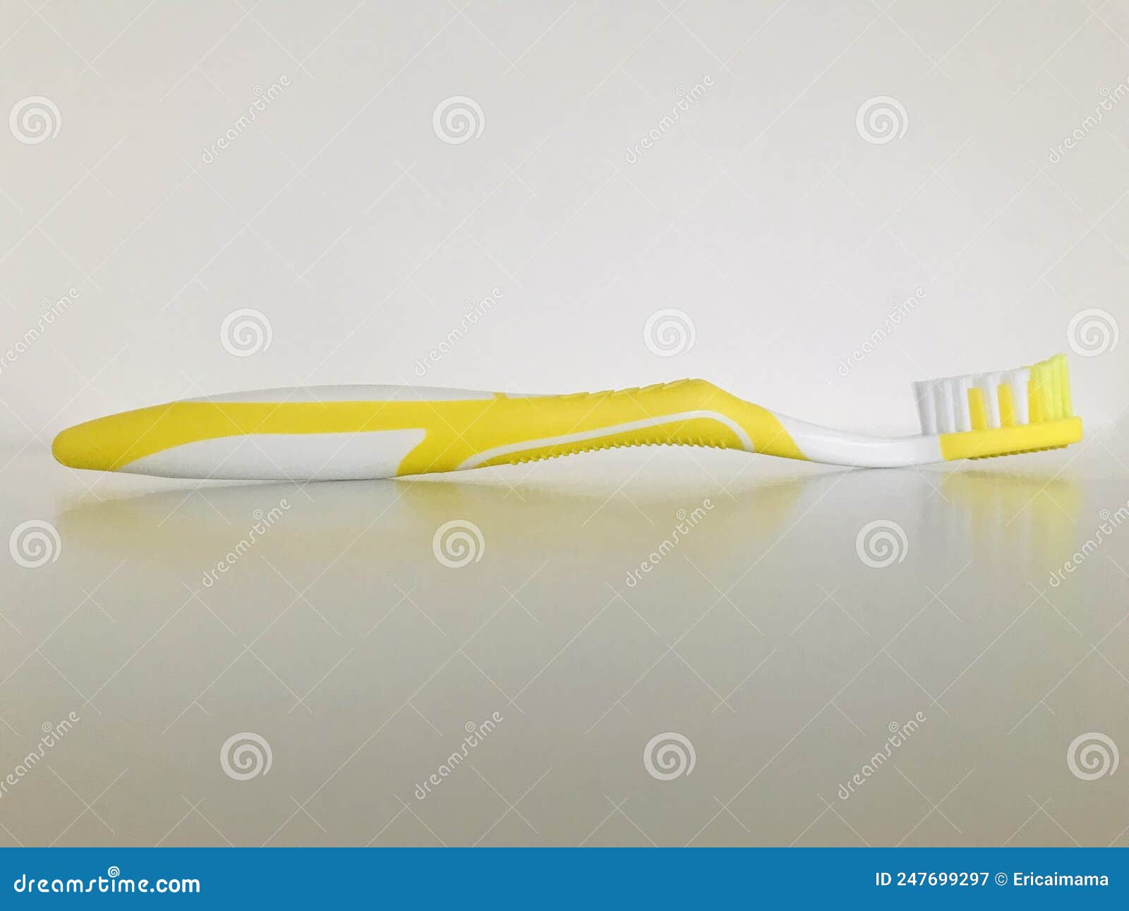 A Yellow and White Toothbrush on White Marble Texture Background. Stock ...