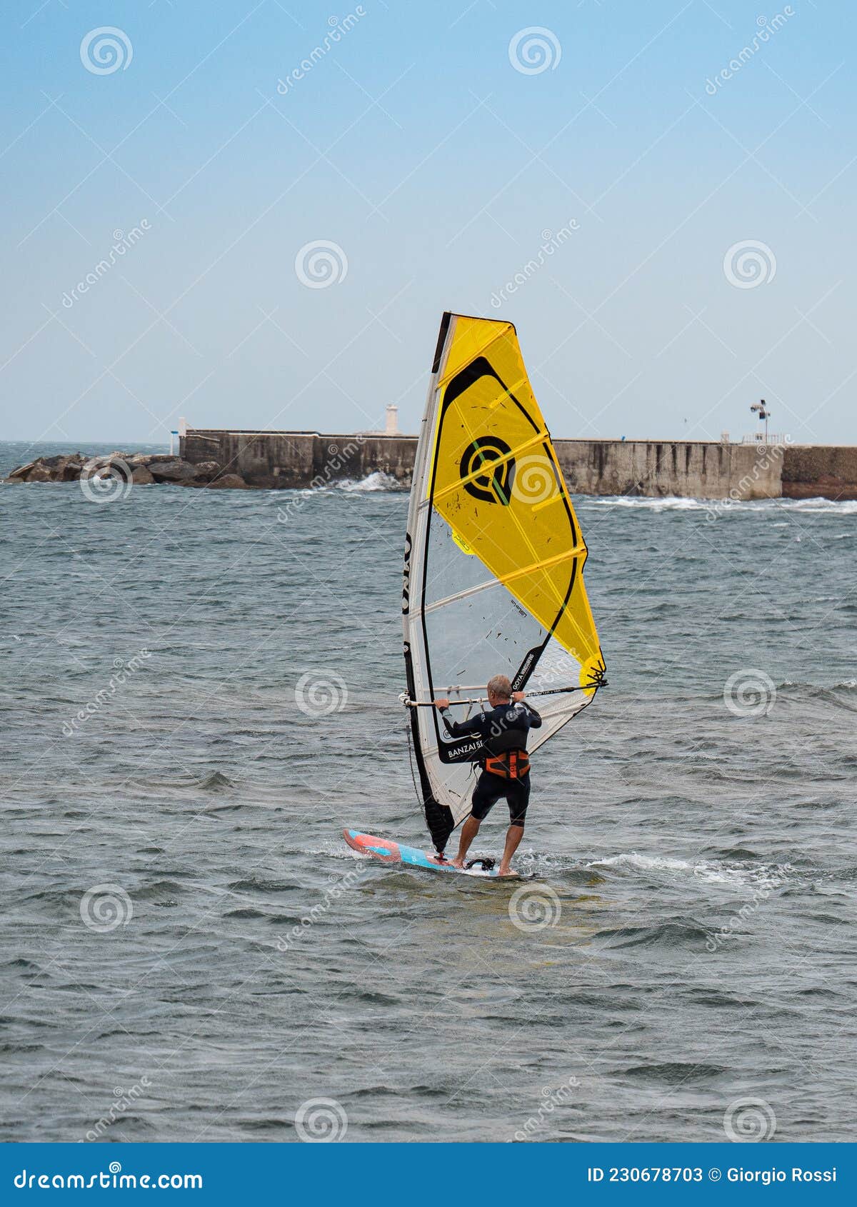Yellow Windsurf Riding the Waves in a Choppy Sea Editorial Stock Photo ...