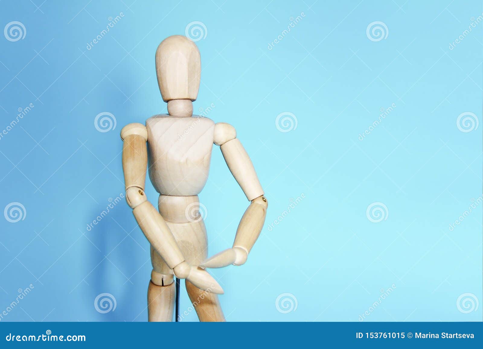 Yellow Wooden Maniken is Dancing and Doing Poses on Blue Background ...