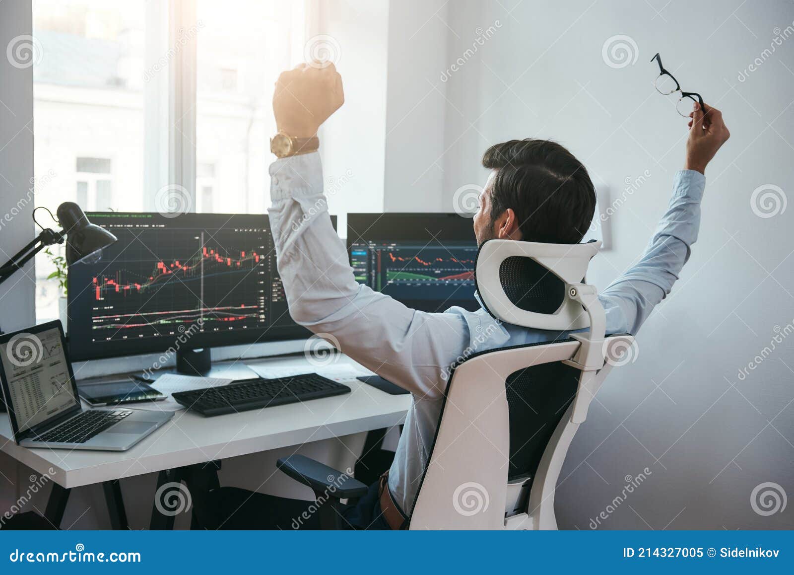 Yes Back View of Stock Trader with Raised Hands Looking at Multiple ...