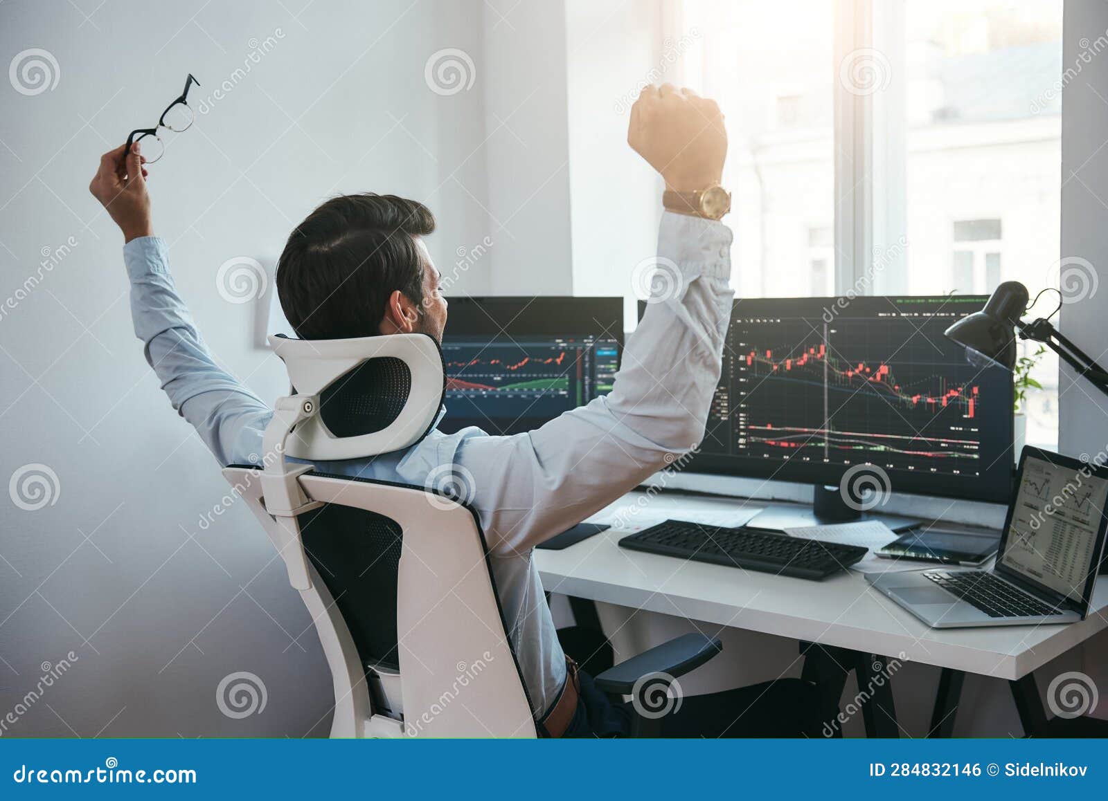 Yes Back View of Stock Trader with Raised Hands Looking at Multiple ...