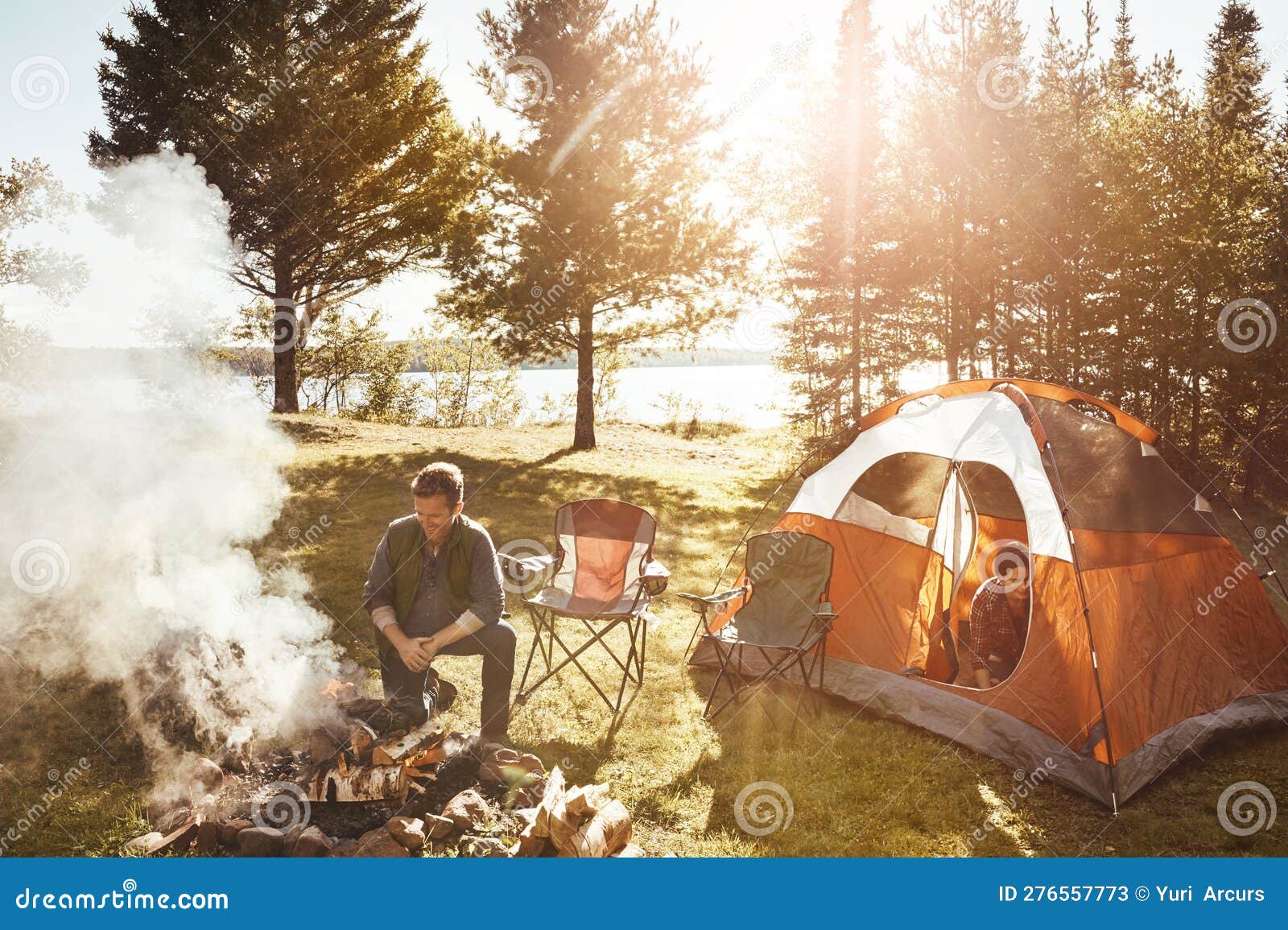 Yes the Fire is Coming Along. a Young Married Couple Camping in the ...