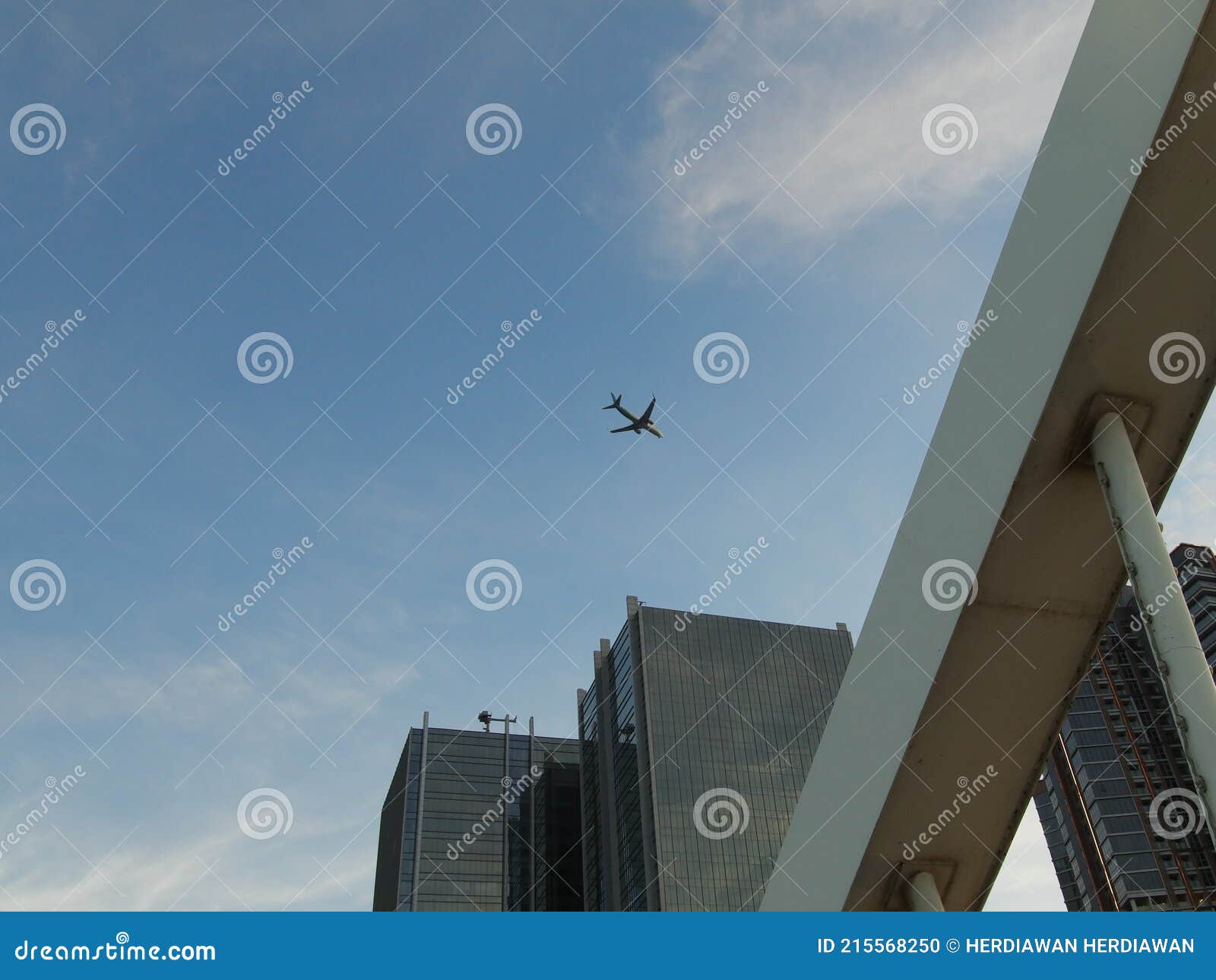 Plane between Apartment Buildings Stock Photo - Image of facade ...
