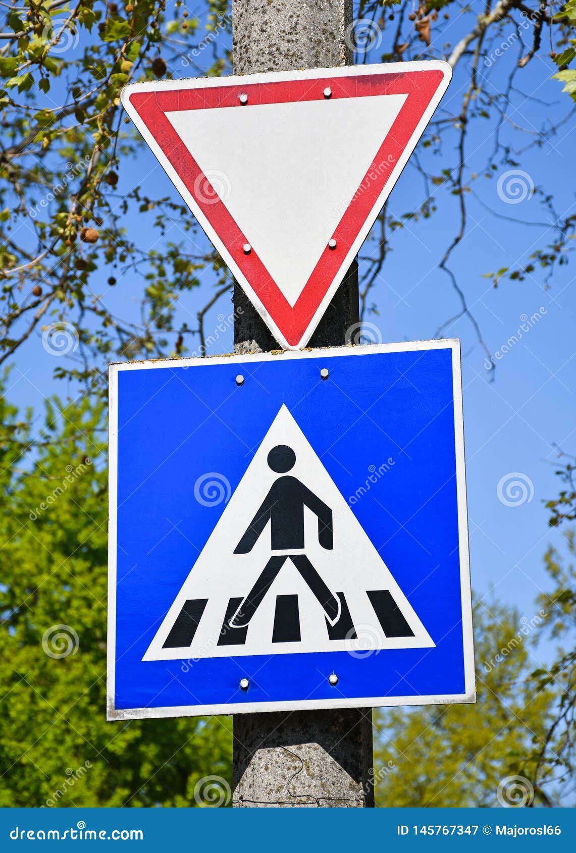 Yield and Pedestrian Traffic Signs on a Pole Stock Image - Image of ...