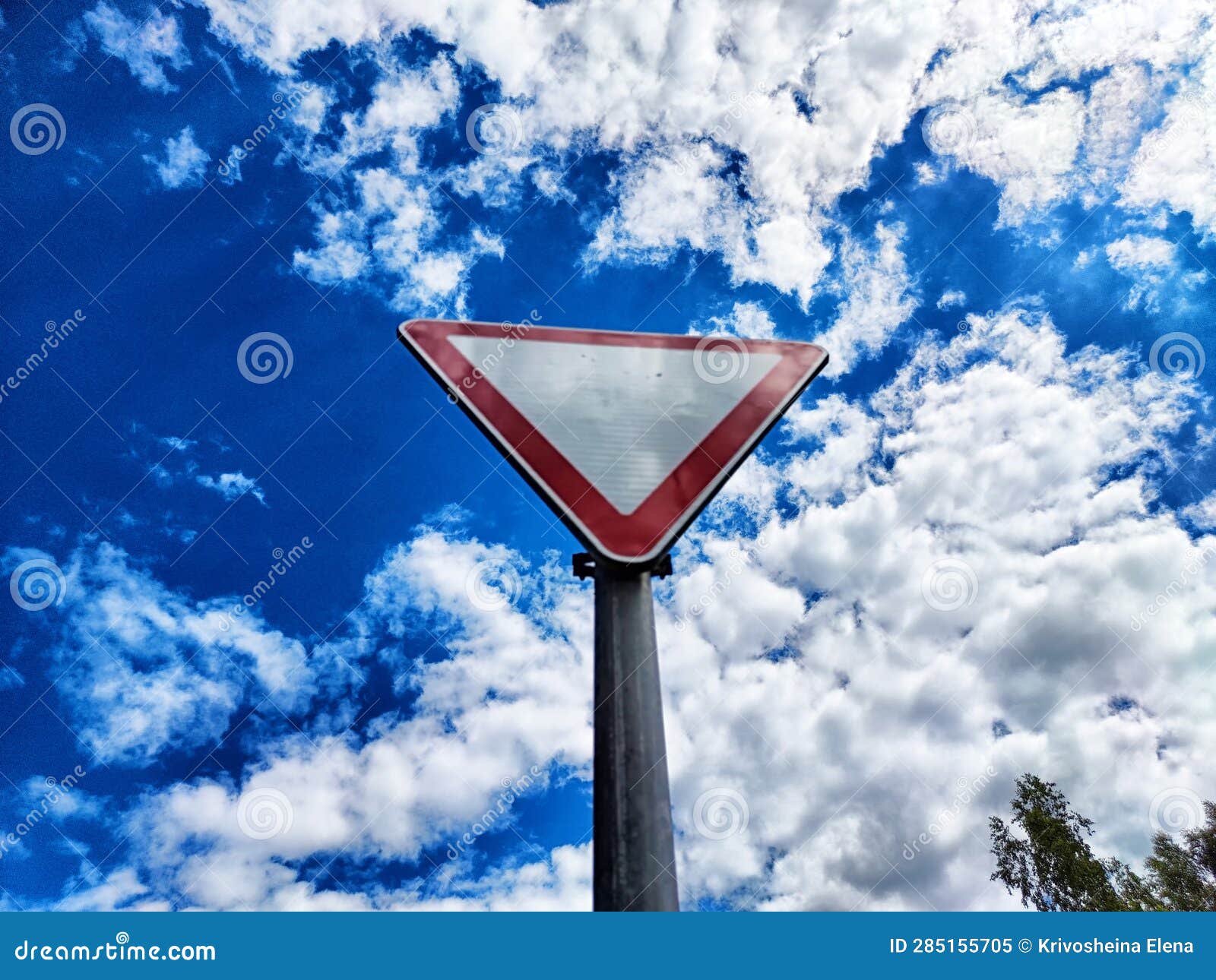 Yield Road Sign. Red Triangle on a White Background Against a Blue Sky ...