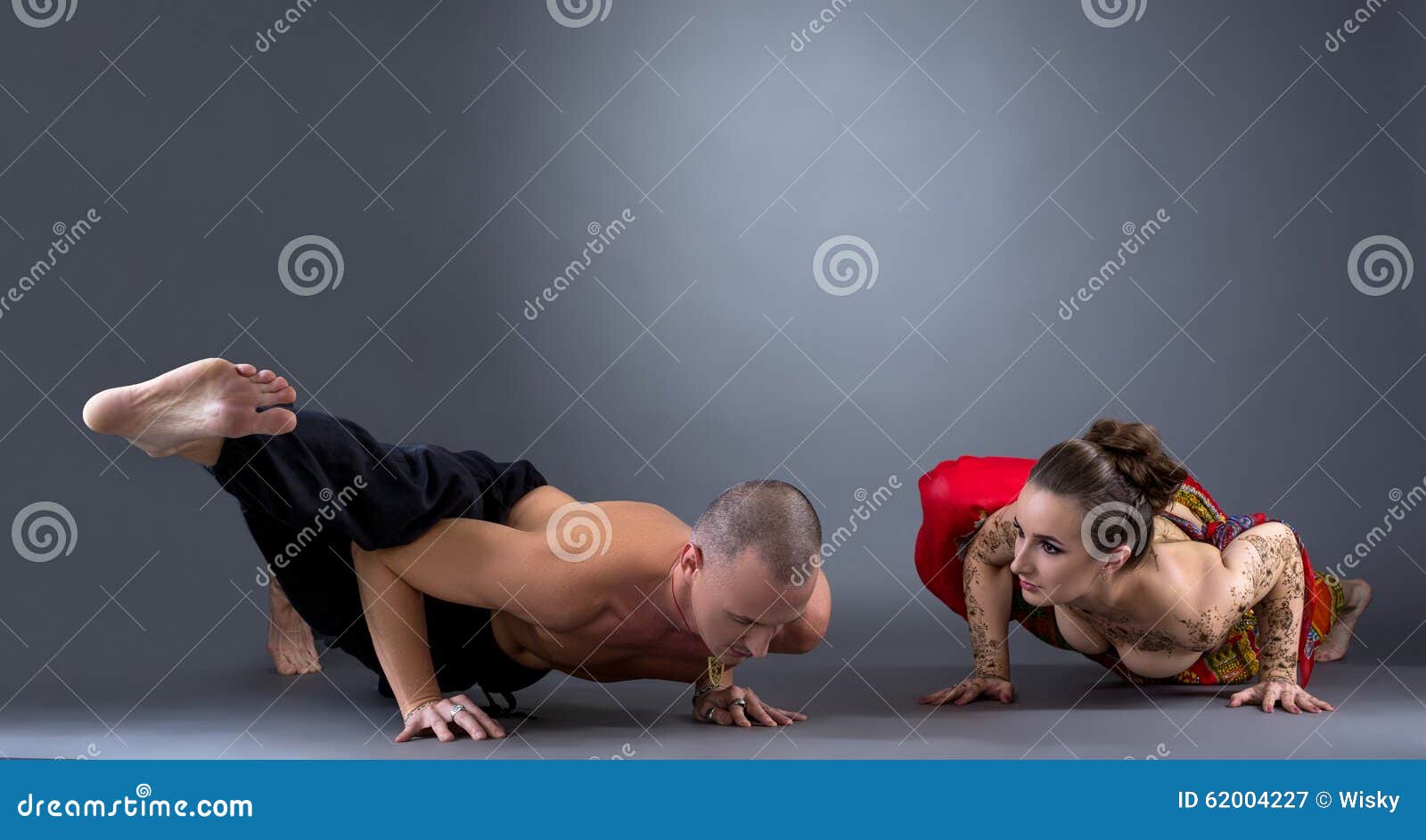 Yoga. Beautiful Couple Doing Difficult Asana Stock Image - Image of ...