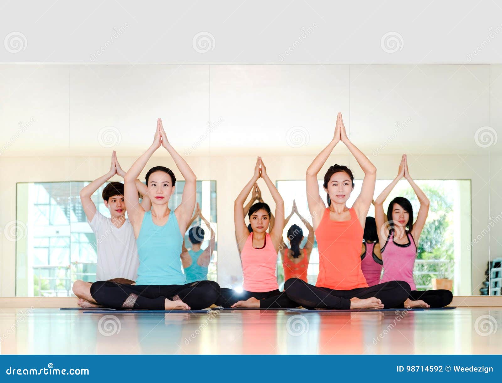 Yoga Class in Studio Room,Group of People Doing Seated Tree Pose Stock ...