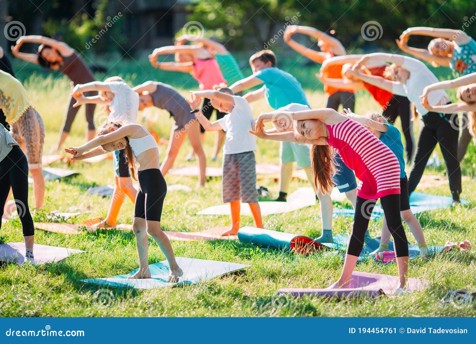 Yoga Classes Outside on the Open Air. Kids Yoga, Stock Image - Image of ...