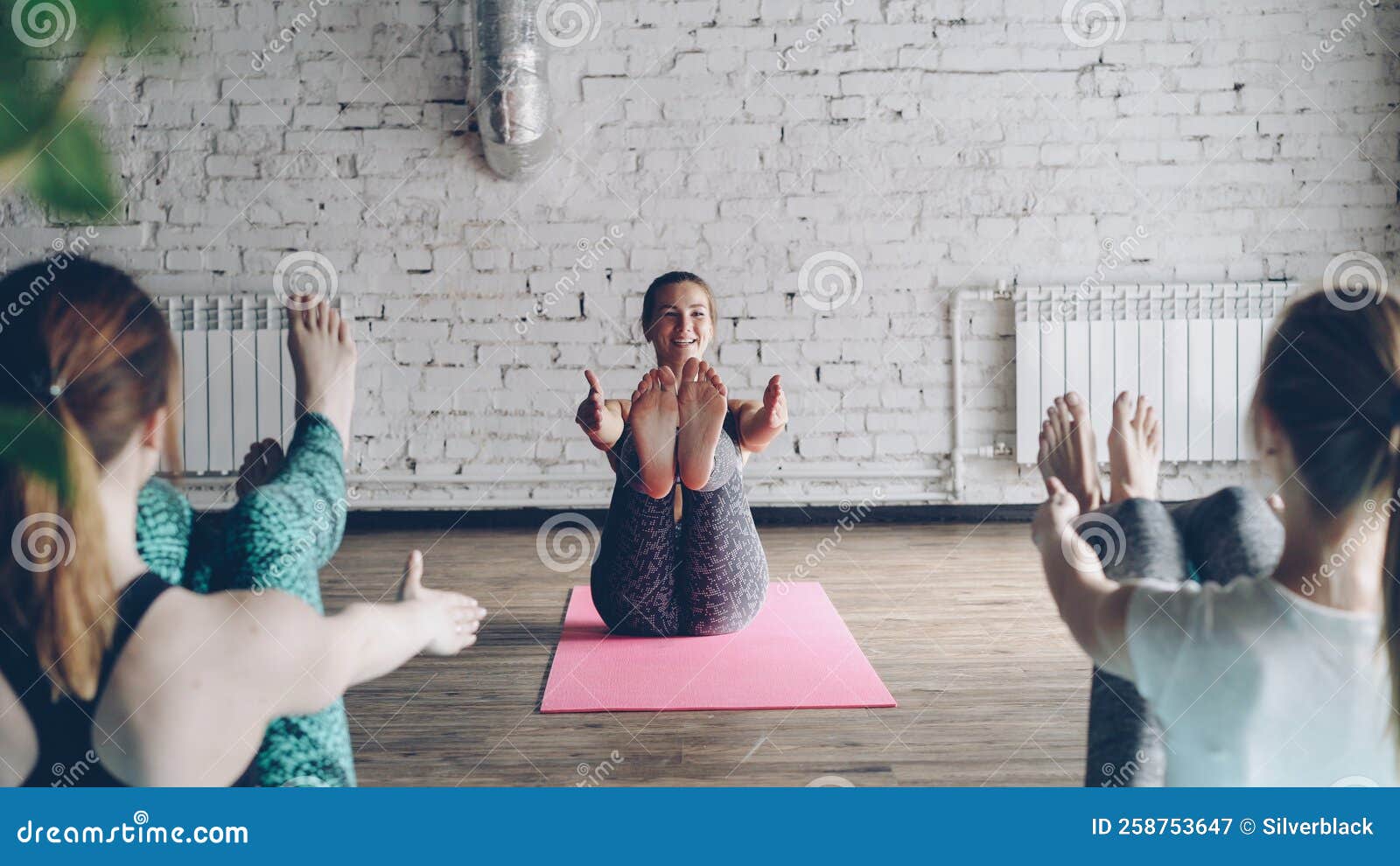 Yoga Instructor is Demonstrating Different Variations of Boat Pose ...