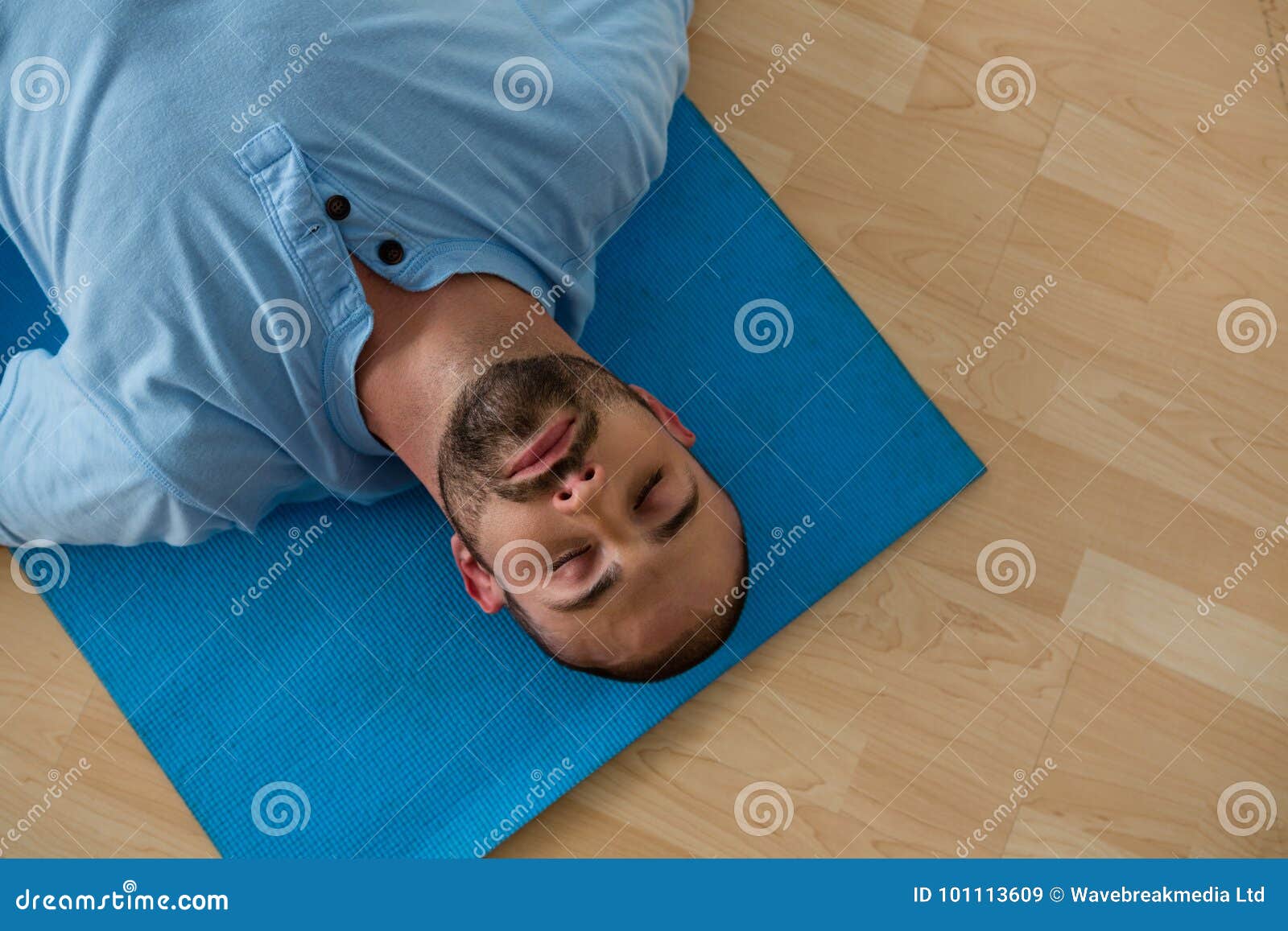 Yoga Instructor Exercising while Lying on Mat in Yoga Studio Stock ...