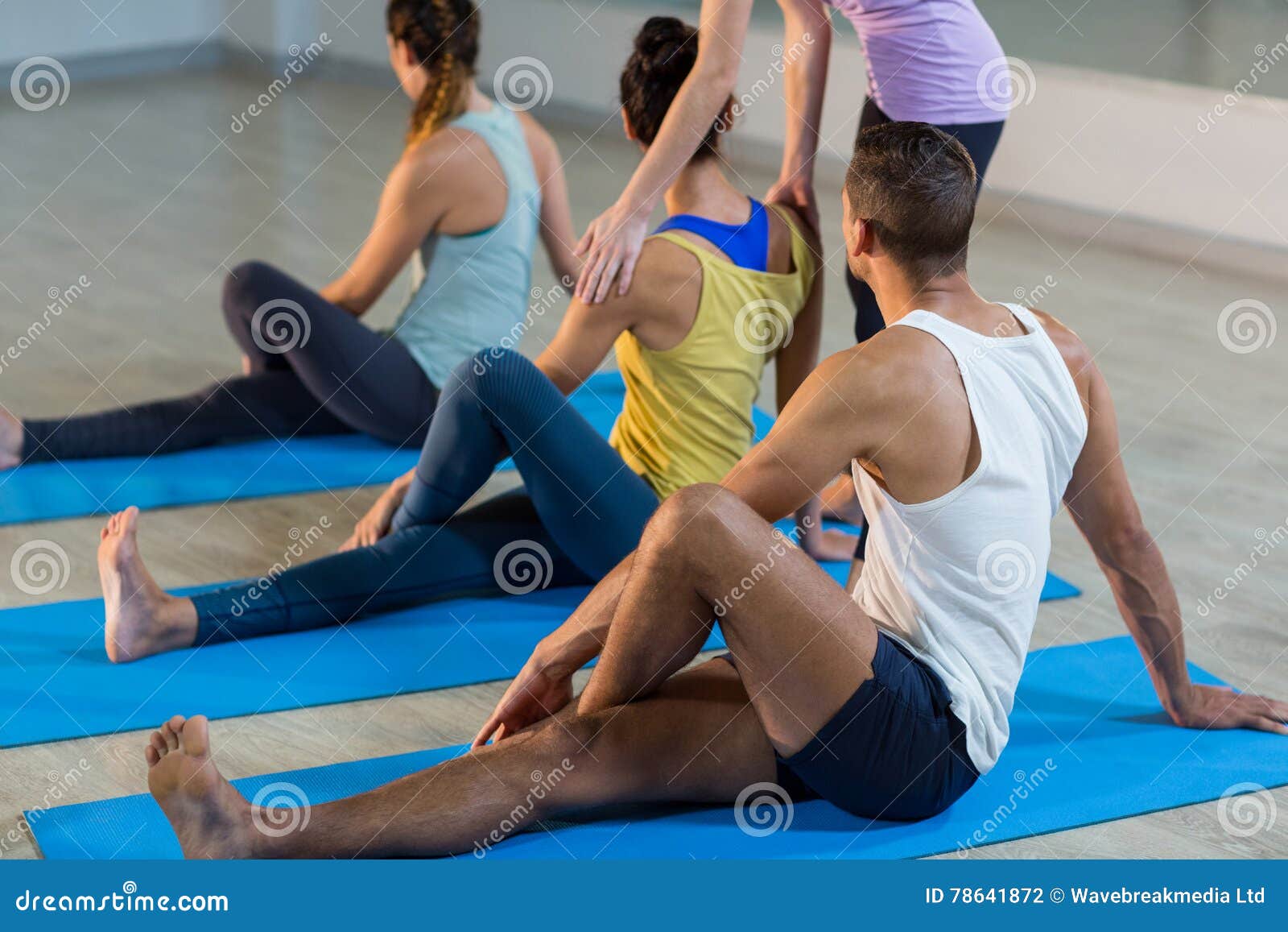 Yoga Instructor Helping Student with a Correct Pose Stock Photo - Image ...
