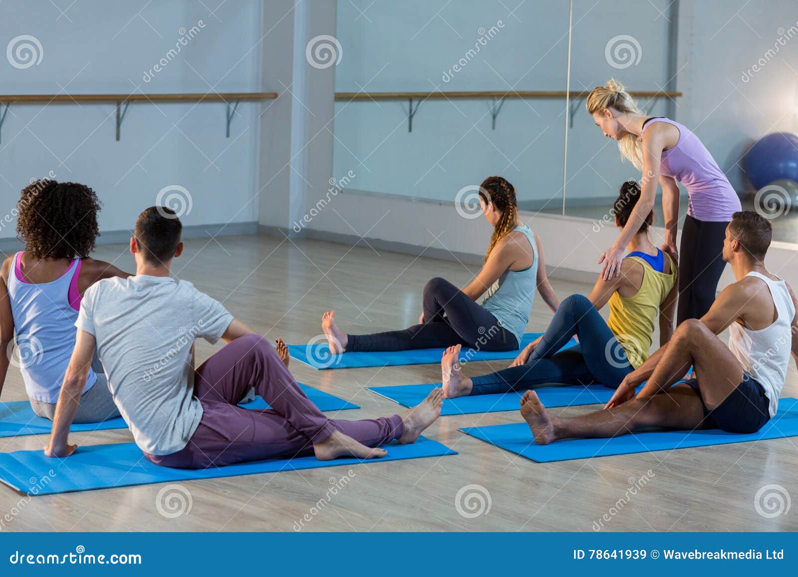 Yoga Instructor Helping Student with a Correct Pose Stock Image - Image ...