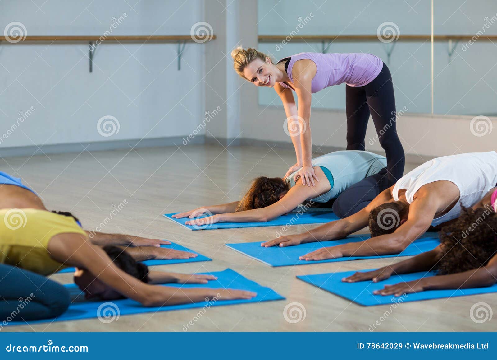 Yoga Instructor Helping Student with a Correct Pose Stock Image - Image ...