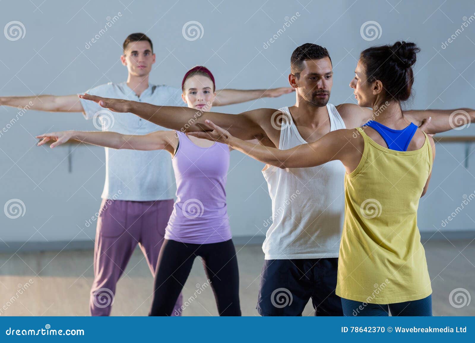 Yoga Instructor Helping Student with a Correct Pose Stock Photo - Image ...