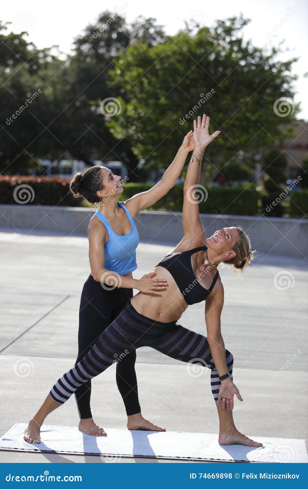 Yoga Instructor Helping the Student Stock Photo - Image of smiling ...