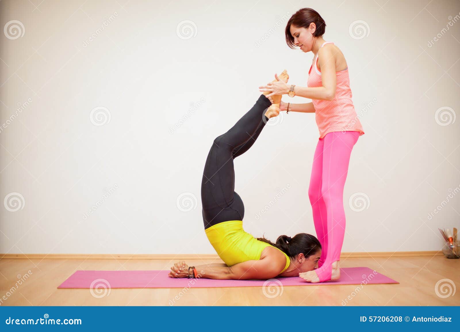 Yoga Instructor Helping a Student Stock Photo - Image of lifestyle ...