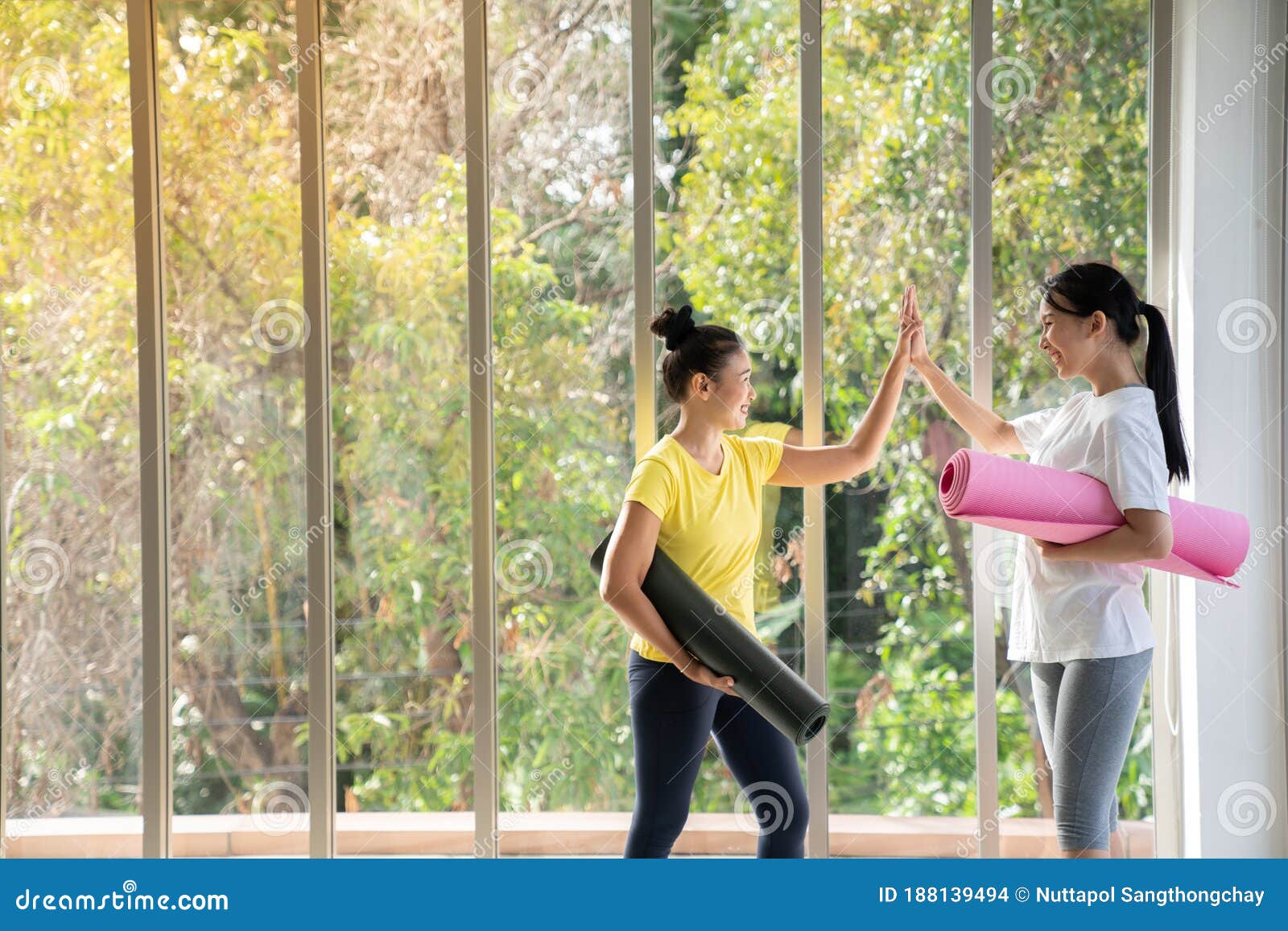 Yoga Partner after Practicing Exercise in Studio. Pair Yoga Stock Photo ...