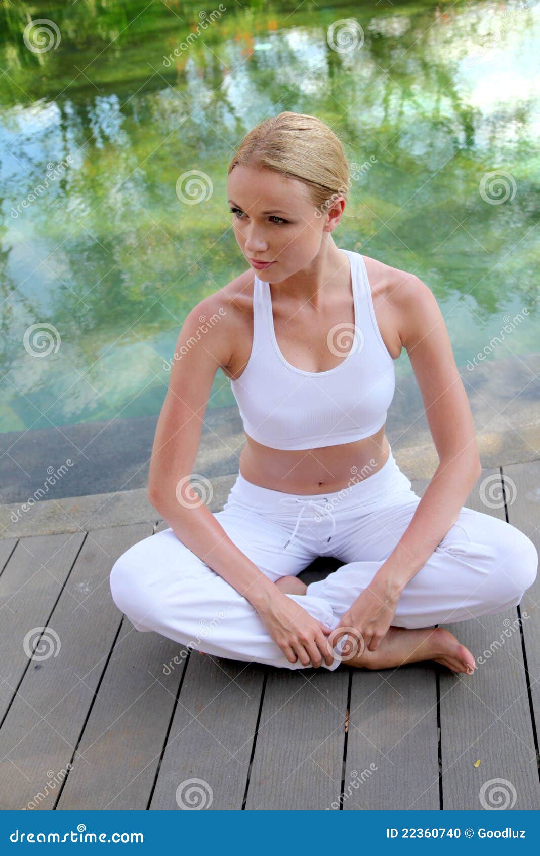 Yoga by the pool stock photo. Image of attractive, health - 22360740