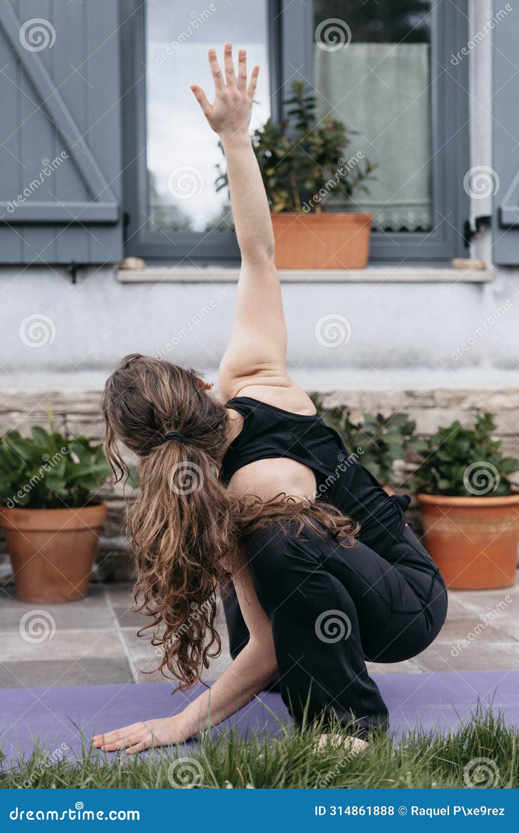Yoga Practitioner in Twisted Pose Reaching Skyward Stock Photo - Image ...