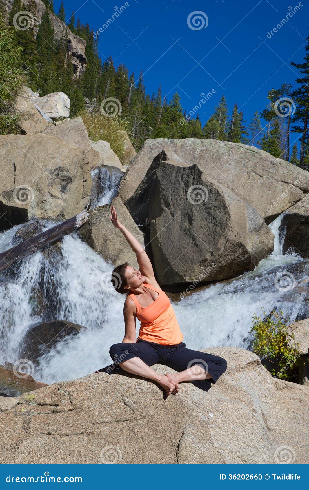 Yoga at a Waterfall stock photo. Image of stretching - 36202660