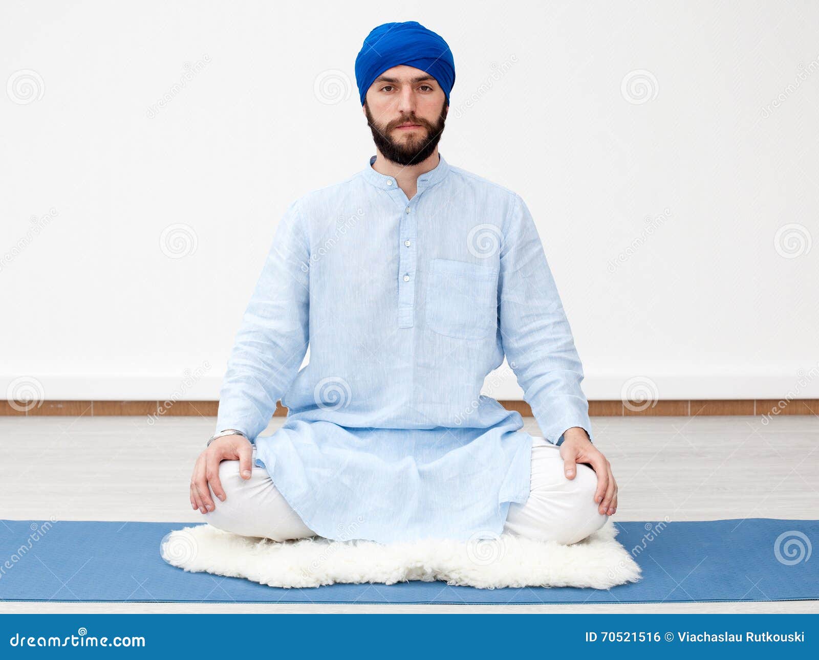 Yogi Man Sitting On The Mat Stock Photo | CartoonDealer.com #70521516