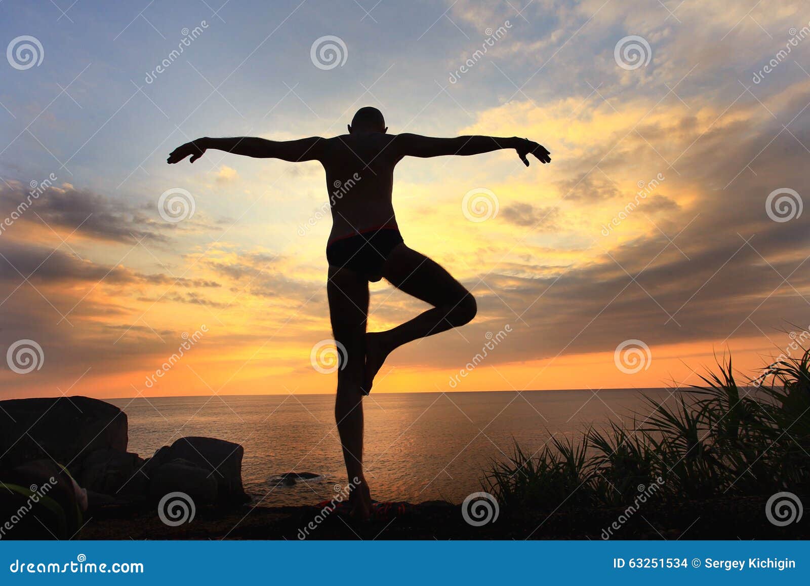 Yogi meditating at sunset stock photo. Image of healthy - 63251534