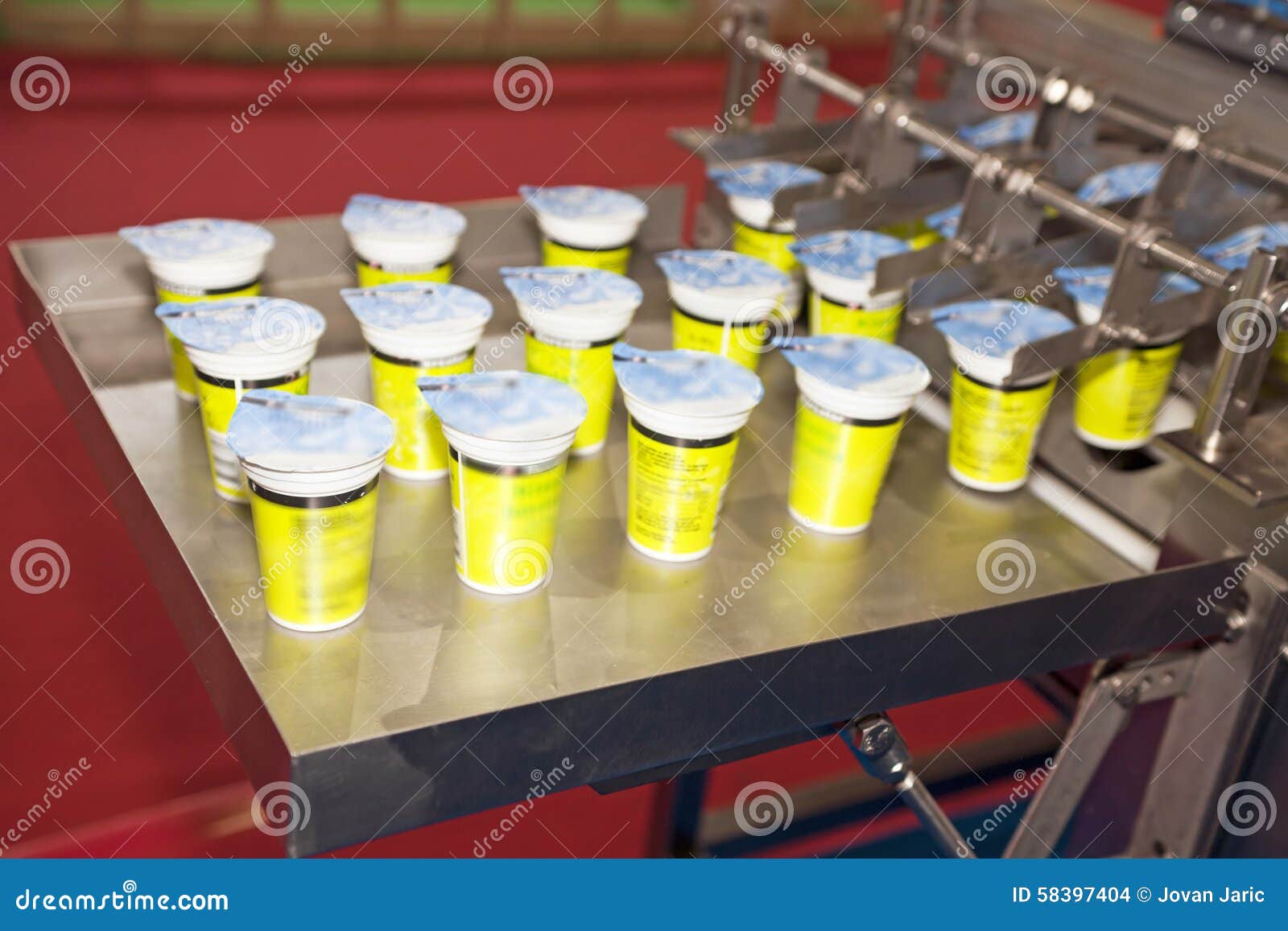 Yogurt Filling and Sealing Machin Stock Photo - Image of mechanical ...