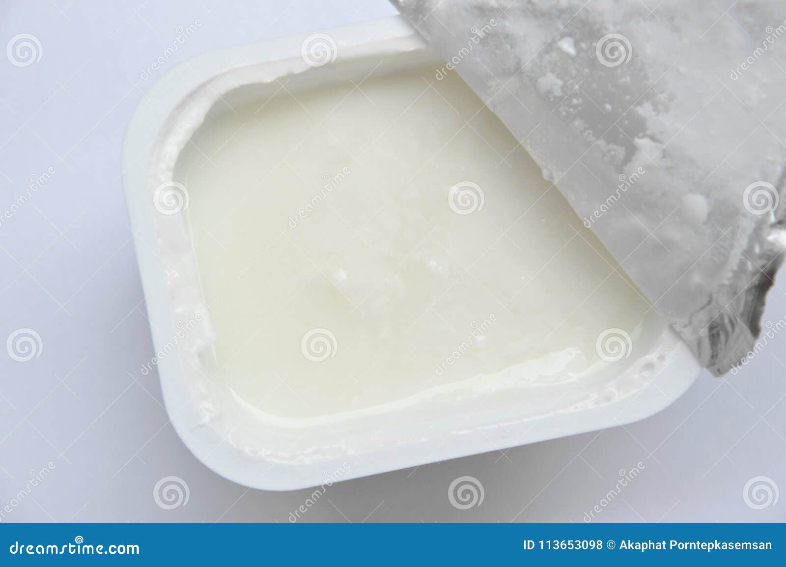 Yogurt Open from Plastic Cup on White Background Stock Photo - Image of ...