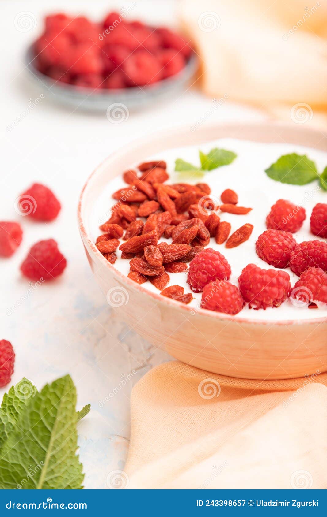 Yogurt with Raspberry and Goji Berries in Ceramic Bowl on White ...