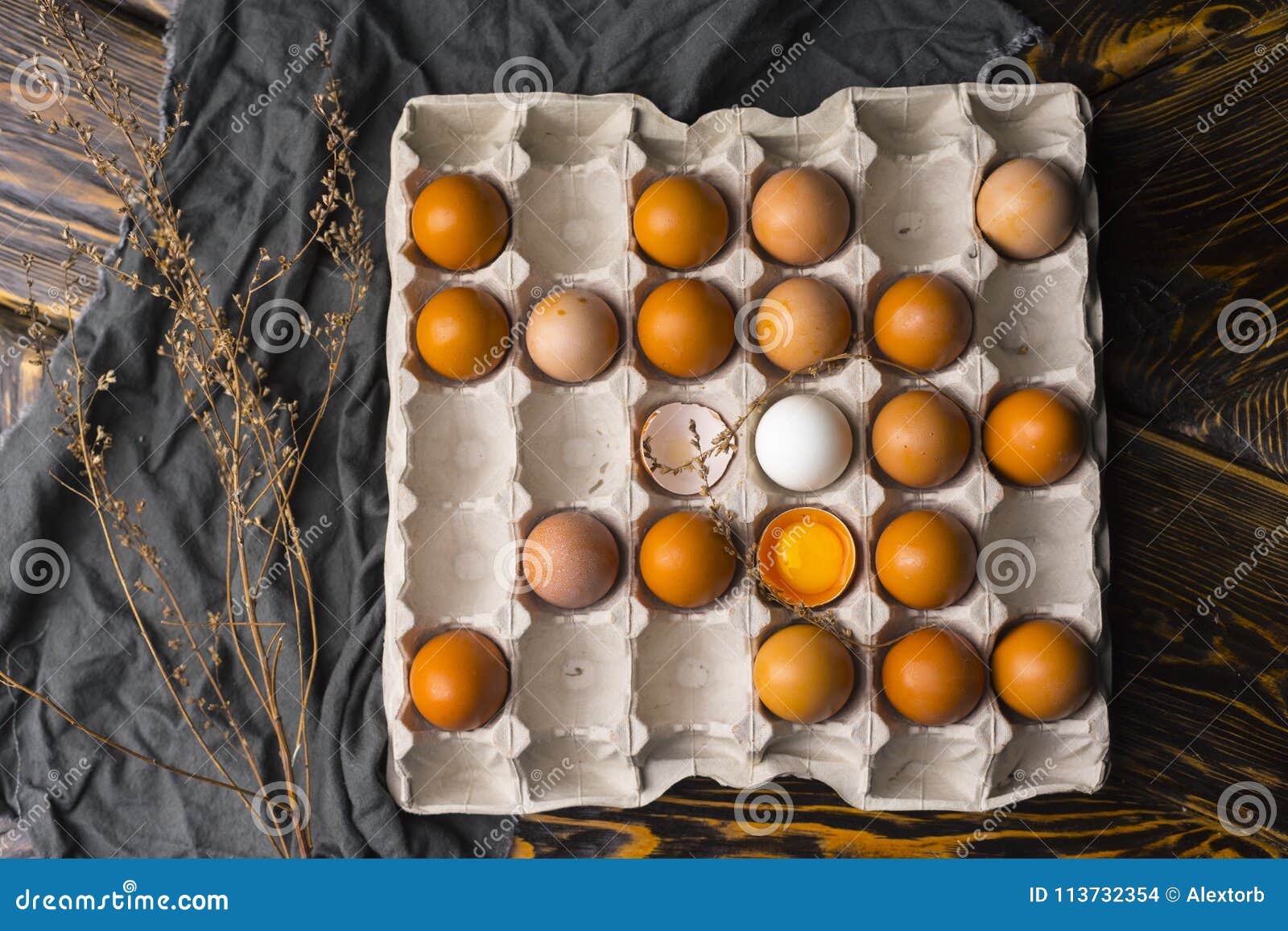 Yolk of Broken Egg in Eggshell and Several Eggs in Carton Egg Bo Stock ...