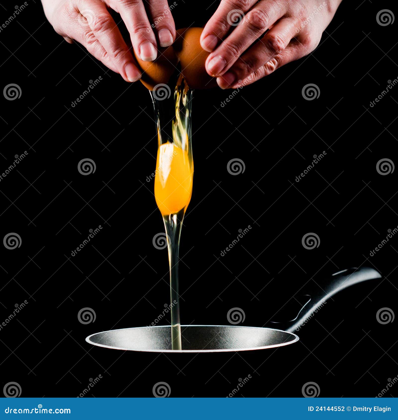 Yolk dropping in pan stock photo. Image of drop, crack - 24144552