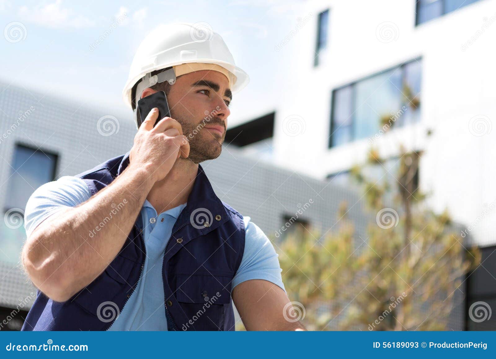 Yong Attractive Worker Using Mobile Phone on a Construction Sit Stock ...