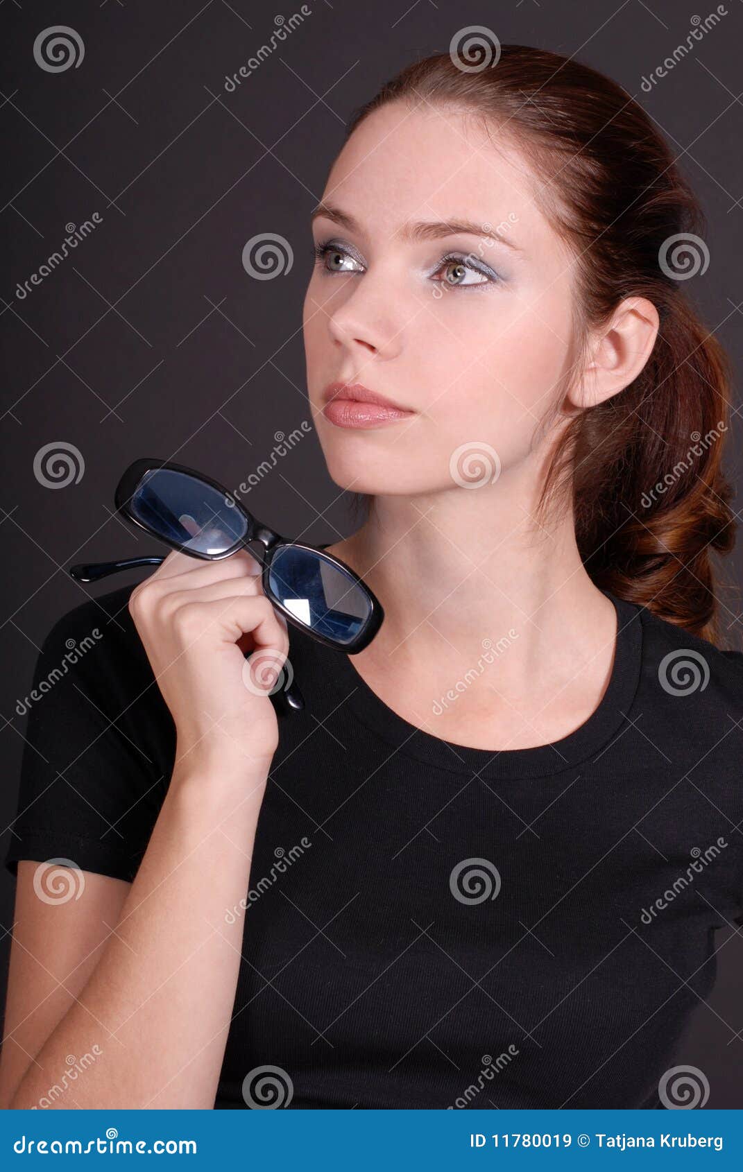 Yong woman holding glasses stock image. Image of holding - 11780019