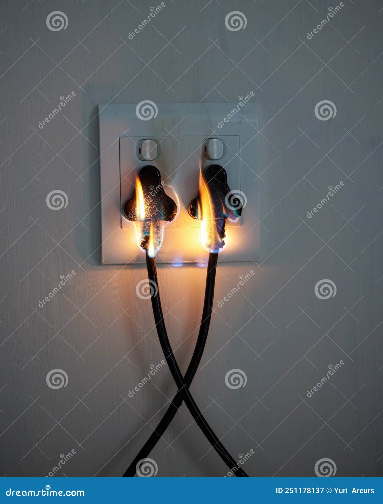 Are You Covered. Two Plugs in a Wall Socket Catching Fire. Stock Image ...