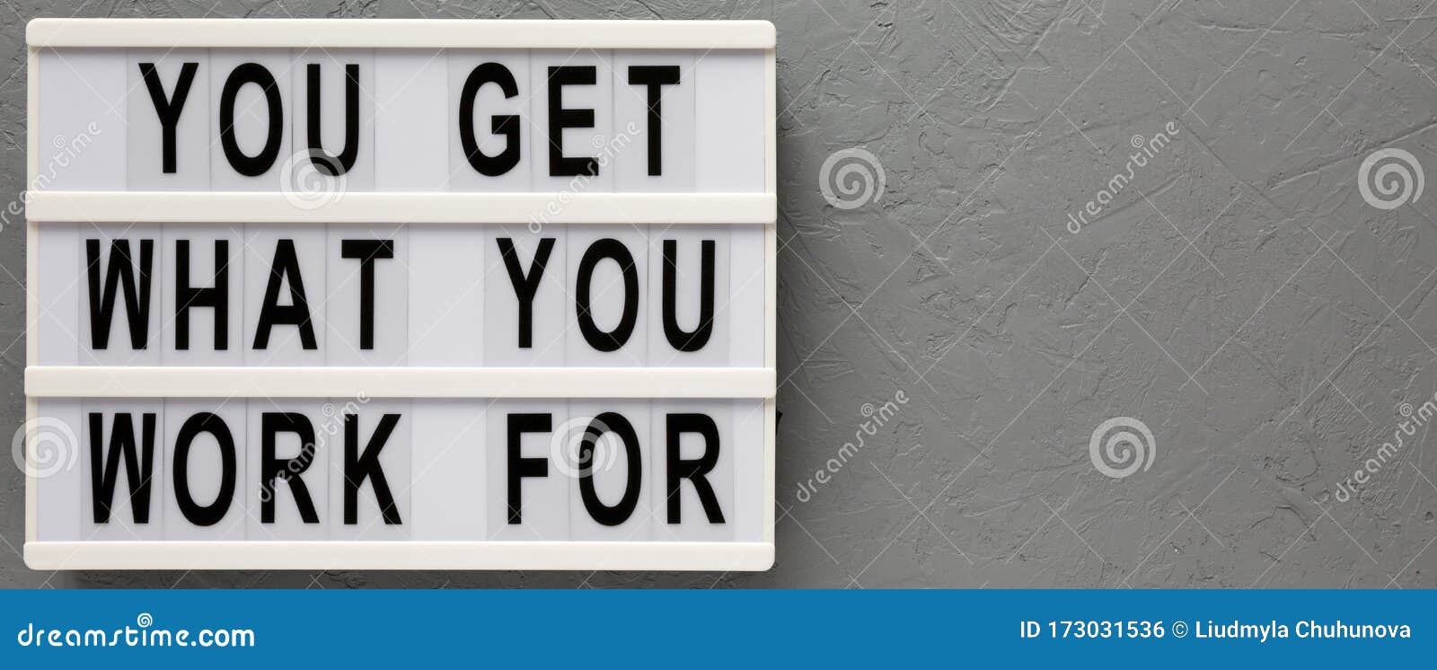 `You Get What You Work for` Words on a Lightbox on a Gray Surface, Top ...
