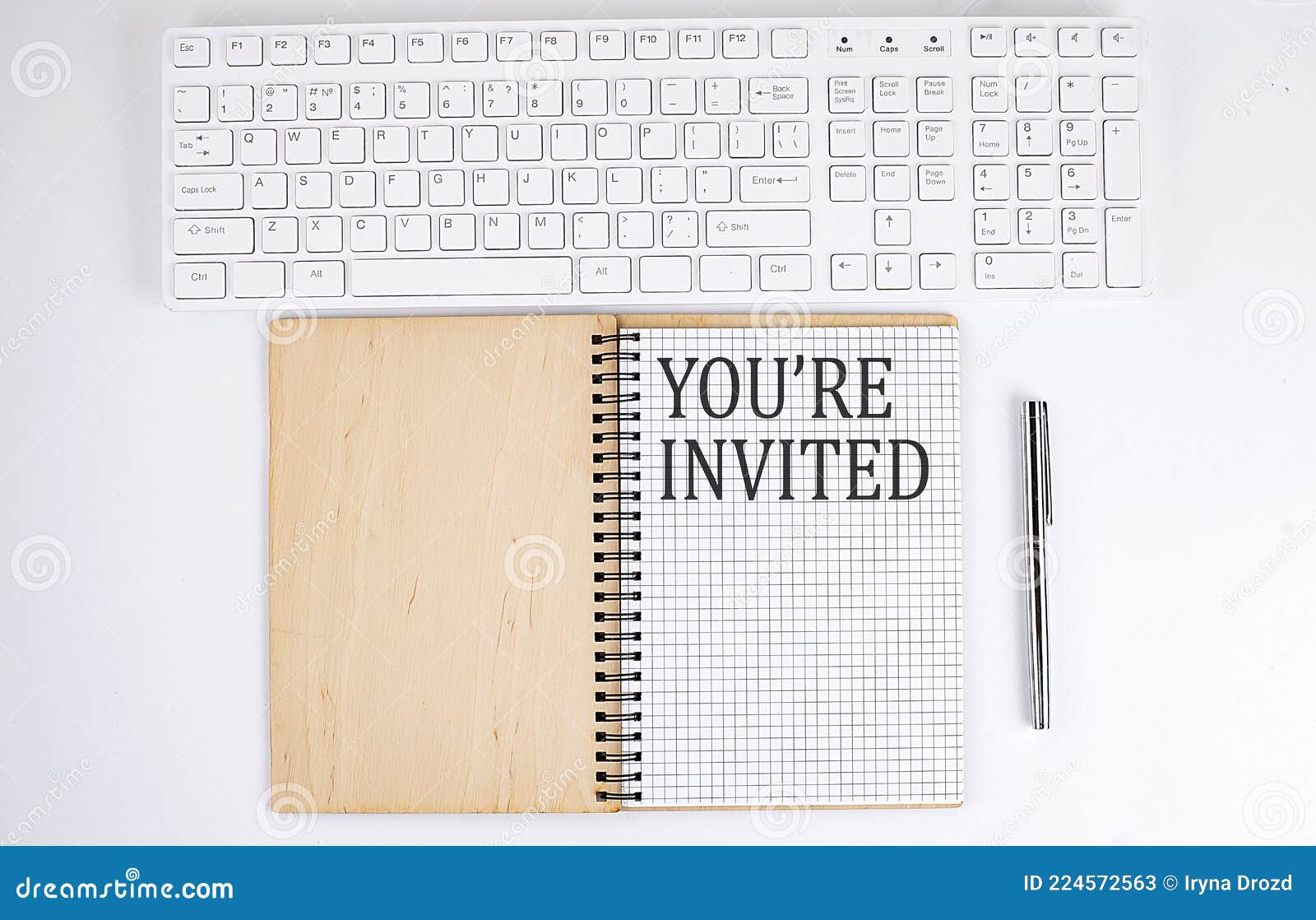 YOU`RE INVITED Text on the Notebook with Keyboard on White Background ...