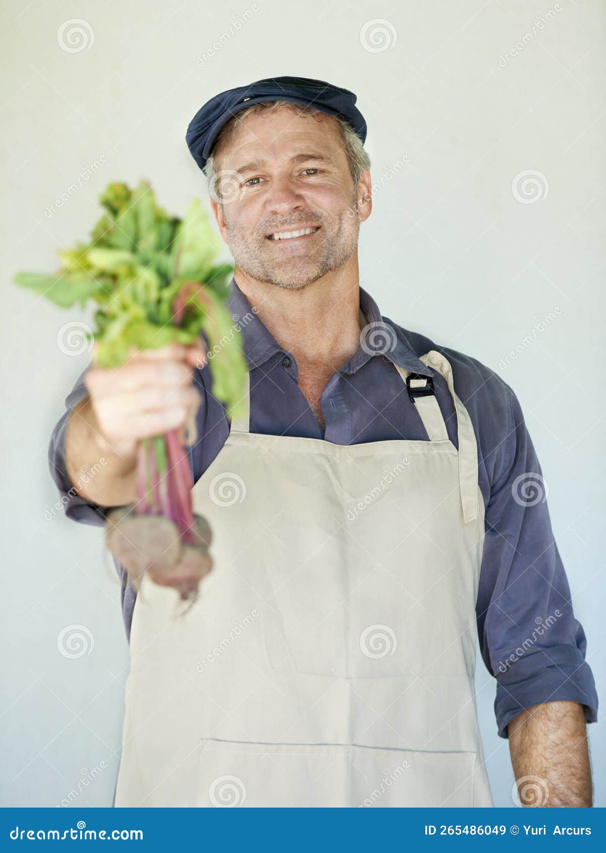You Should Try Ours. a Mature Man Holding a Bunch of Beetroot. Stock ...