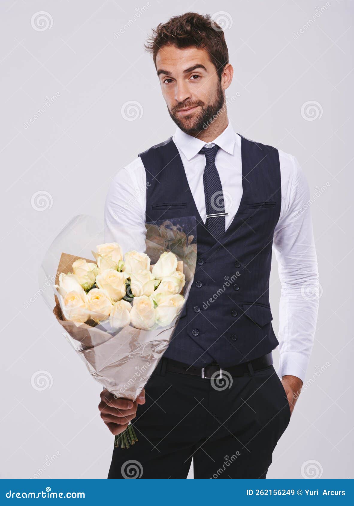 These are for You. Studio Shot of a Handsome and Well-dressed Young Man ...