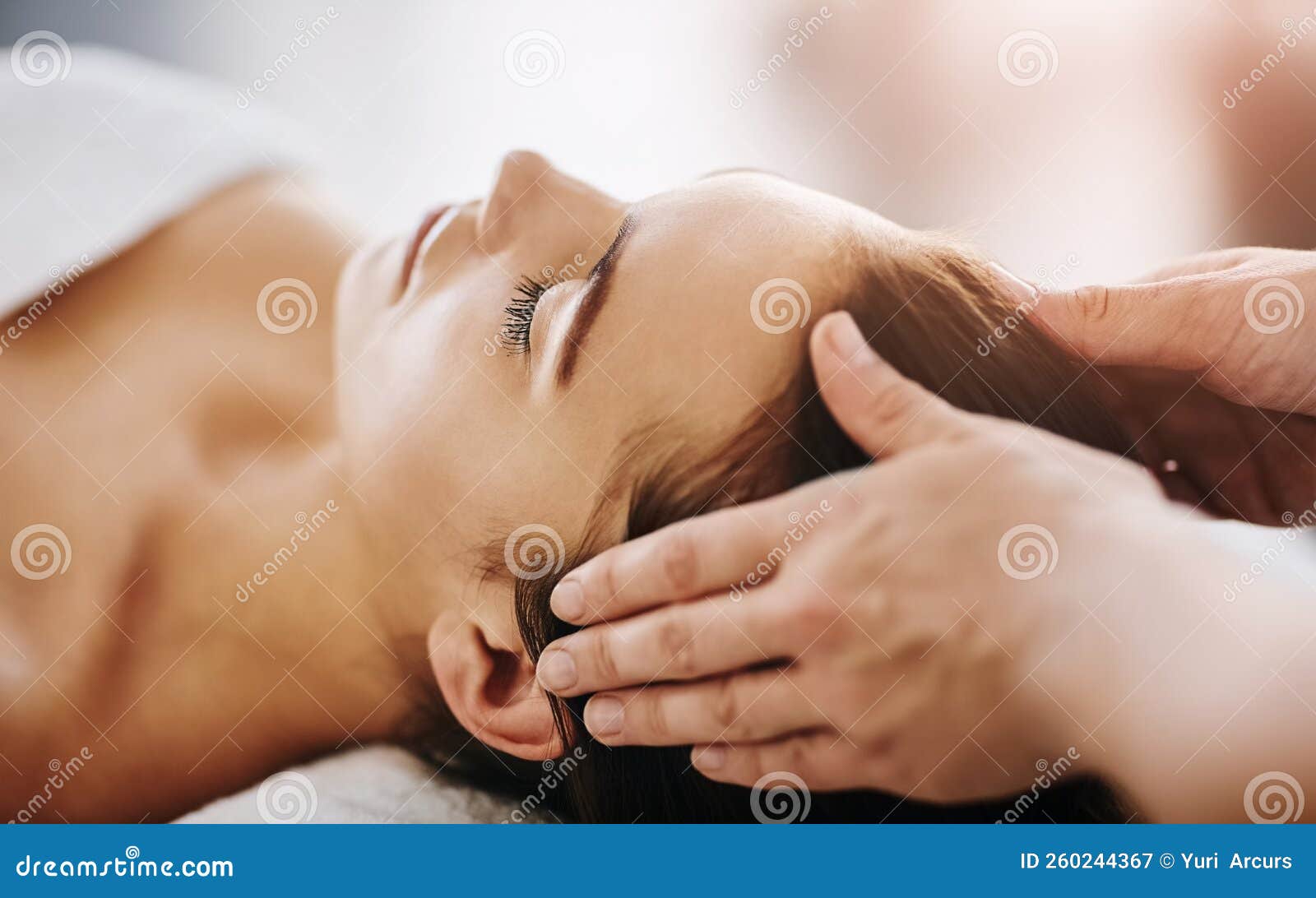 You Wont Regret A Head Massage A Beautiful Young Woman Getting A Head Massage At A Spa Stock