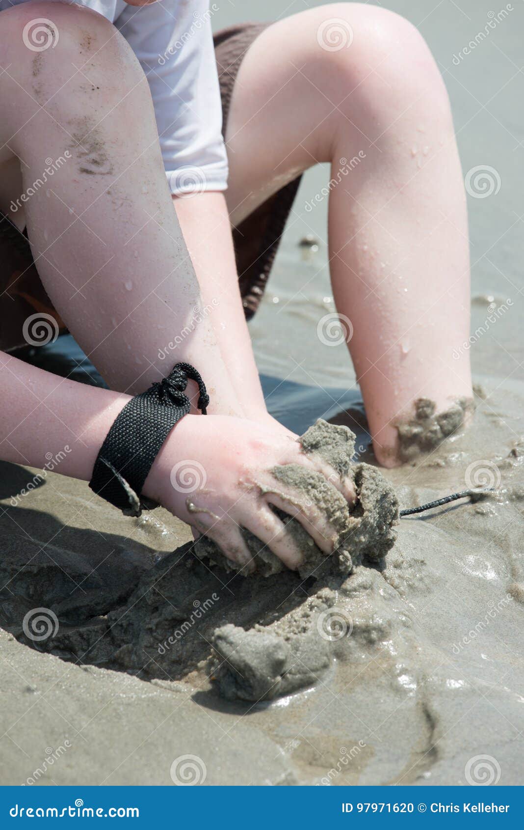 Yound Toddler Boy Having Fun Digging in the Sand at the Beach Stock ...